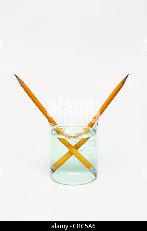 Pencil in a beaker with water Stock Photo - Alamy