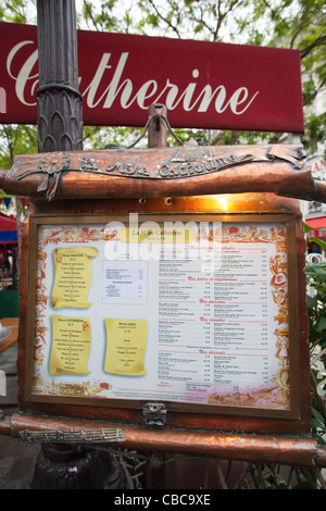 Paris, France restaurant menu board with people eating in the ...