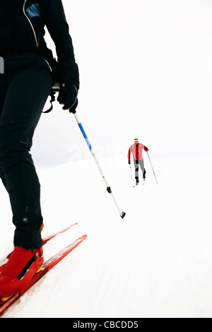 Cross-country skiing: two women cross-country skiing on a winter day ...