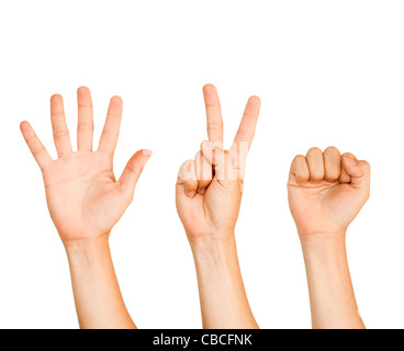 Hands making rock, paper, scissors gesture on a wooden background Stock ...