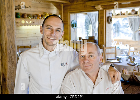 Father and son chef team in restaurant Stock Photo - Alamy