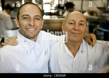 Father and son chef team in restaurant Stock Photo - Alamy