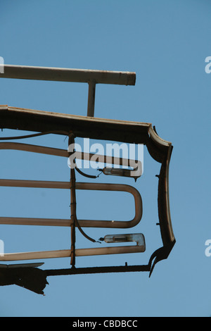 old damaged neon sign outside shop front in city town Stock Photo - Alamy