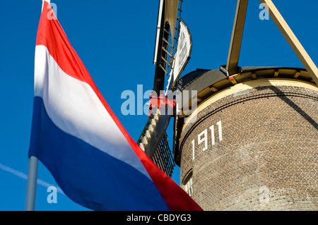 Dutch flag flying in front of Windmill at De Zaanse Schans, Netherlands ...