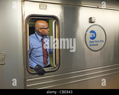 subway conductor in train car Stock Photo - Alamy