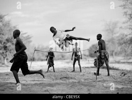 Jumping rope child in Africa, rope skipping African boy Stock Photo - Alamy