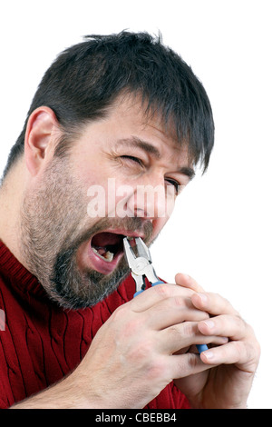 Pulling teeth at the dentist with pliers Stock Photo - Alamy