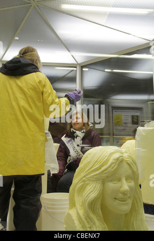 A butter sculptor at the Minnesota State Fair creating a sculpture of a ...