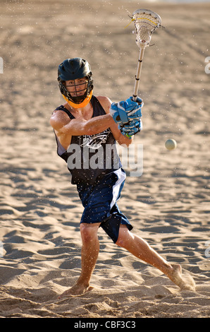 A portrait of a lacrosse athlete on the beach Stock Photo - Alamy