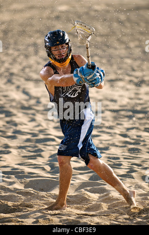 A portrait of a lacrosse athlete on the beach Stock Photo - Alamy
