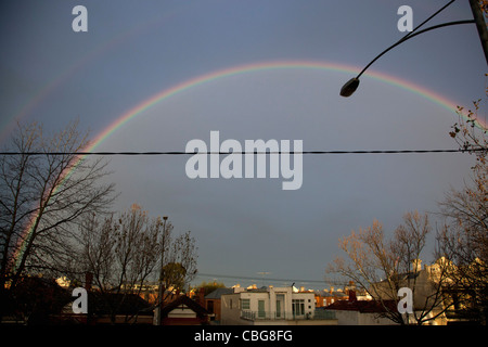 double rainbow over the city, residential area, double rainbow over the ...