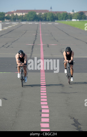 Two cyclists on racing bicycles, side view, low angle view Stock Photo ...