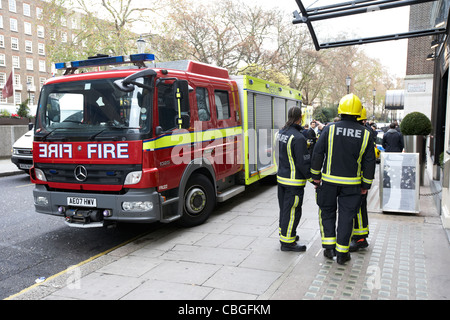 London Fire Brigade fire engine responding to an emergency call in ...