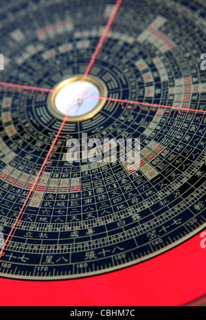 Chinese Feng Shui compass, a Lopan, in hands of Fengshui master, China ...