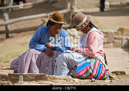 Two indigenous Bolivian women dressed in traditional clothing ...