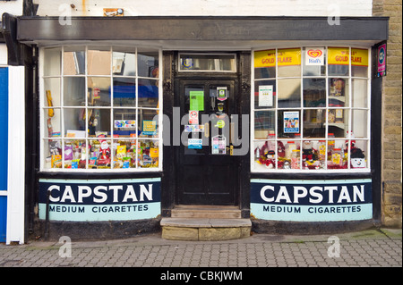 Local newsagent shop with cigarette advertising outside in Kington ...
