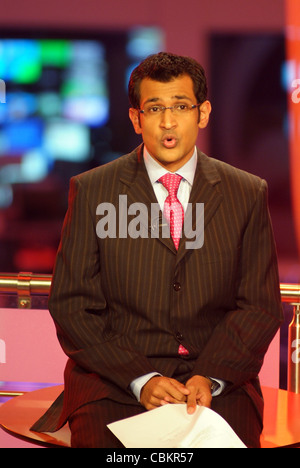 Al Jazeera English anchor delivering the news at the Doha HQ of AJE ...