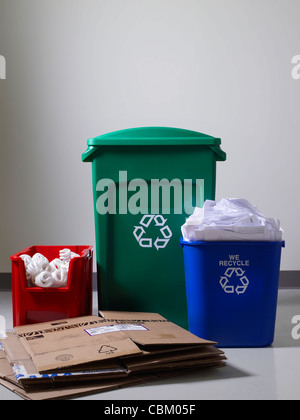 Trash cans with recycling materials, paper, plastic, e-waste, isolated ...