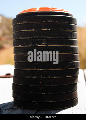 Stack of orange clay pigeons Stock Photo - Alamy
