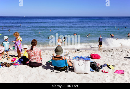 Perth beach, Australia. People sunbathing at Cottesloe Beach on a ...