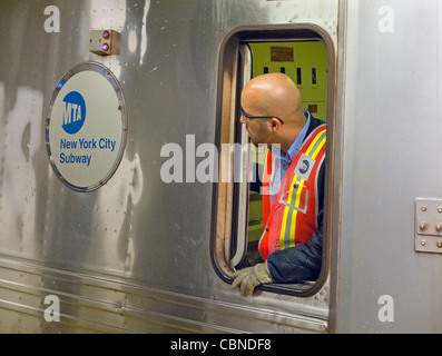 subway conductor in train car Stock Photo - Alamy