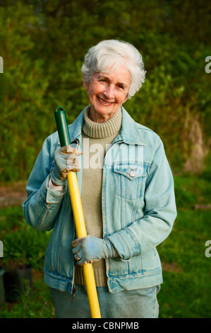 Portrait Of Mature Woman Working In Garden Center Greenhouse Stock ...