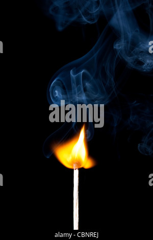 match burning with fire and smoke isolated on black background Stock ...