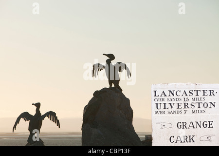 Tern bird sculptures on a fence, Morecambe bay and the promenade ...