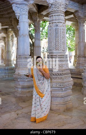 Jain pilgrim with traditional mask at The Ranakpur Jain Temple at ...