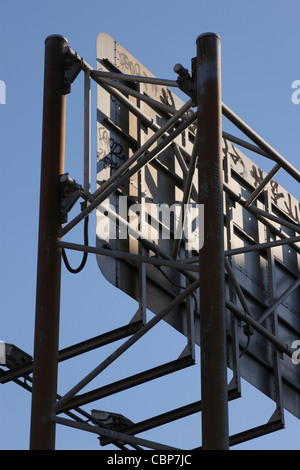 Back side of road sign, blue sky in background Stock Photo - Alamy