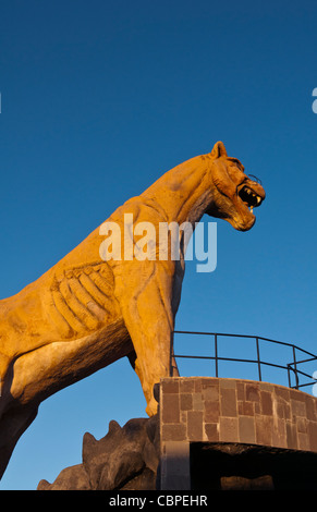 Mountain lion Puma artwork on top of hill in Puno on Lake Titicaca Peru ...