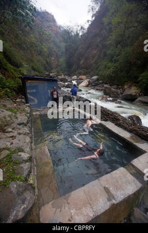 Trekkers relaxing at hot springs. Tatopani village. Annapurna circuit ...