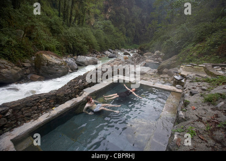 Trekkers relaxing at hot springs. Tatopani village. Annapurna circuit ...