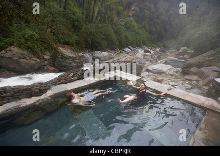 Trekkers relaxing at hot springs. Tatopani village. Annapurna circuit ...