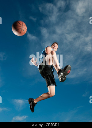A man passing a basketball Stock Photo - Alamy