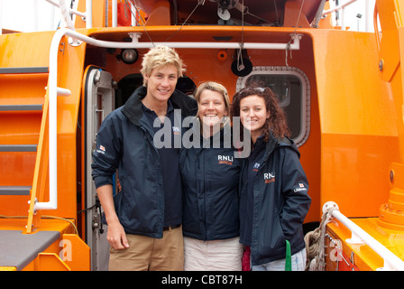 RNLI members stand on a Lifeboat Stock Photo - Alamy