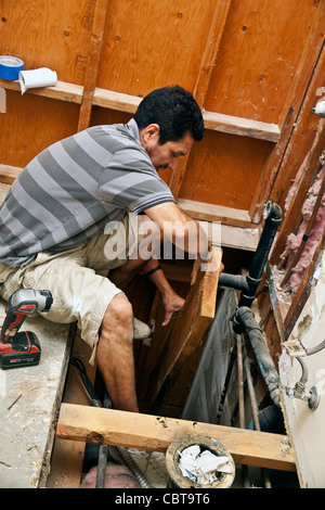 Hispanic man from Mexico working his own construction business in the ...