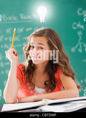 Light bulb, idea and student with classroom innovation, learning ...