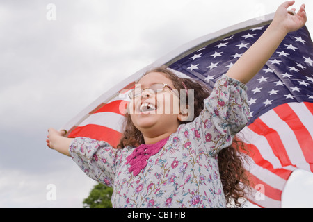 Brunette hispanic girl holding flag of United Kingdom annoyed and ...
