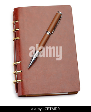 Pen over the notebook isolated on the white Stock Photo - Alamy