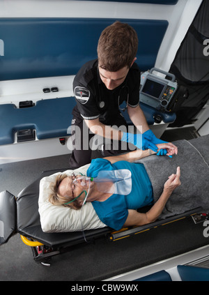 Taking care of elderly people, paramedic helping an elderly woman Stock ...