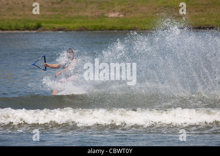 Man jumping the wake, stunts on a wakeboard, extreme sport Stock Photo ...