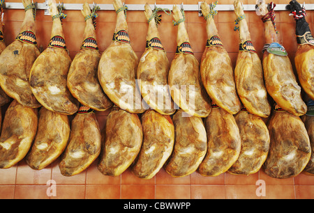 A selection of Jamon, Spanish dry-cured ham displayed for sale in a ...