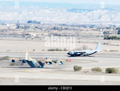 A Spanish air force C-130 Hercules aircraft parks on the flightline to ...