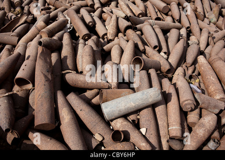 Artillery and mortar shells lie rusting in the sun in a scrap yard in ...