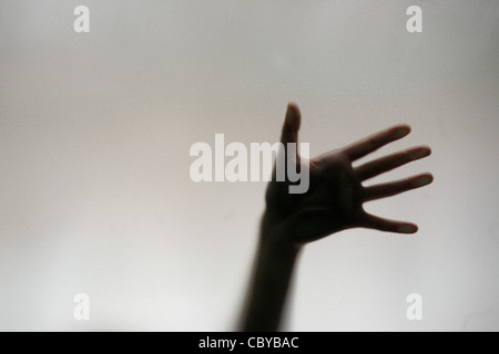 One hand pressed against a diffused screen Stock Photo - Alamy