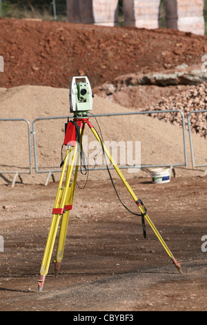 Surveying equipment on a tripod being used by police officers from the ...