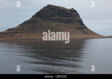Rock emerging from water Stock Photo - Alamy