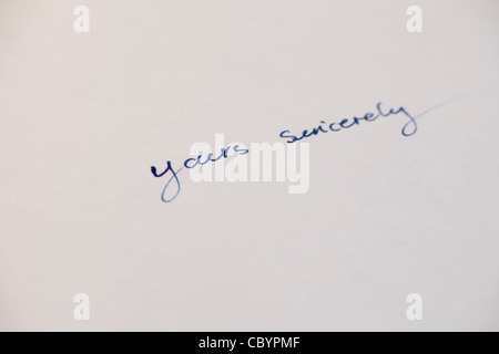 The words "yours sincerely" handwritten in ink with fountain pen in ...