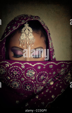 Beautiful Indian woman hiding her face with a scarf Stock Photo - Alamy